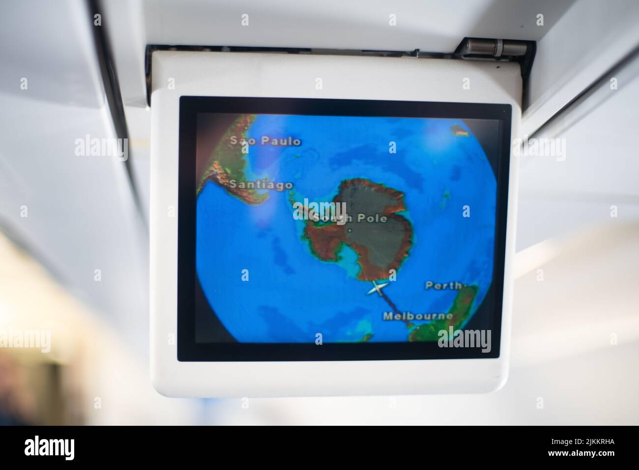 A closeup shot of a map of a plane flying near the South Pole on the ...