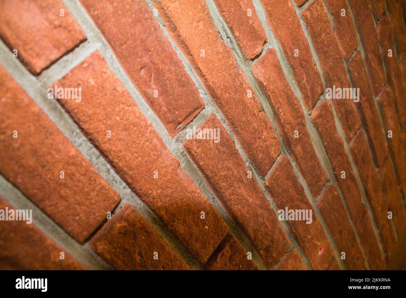 A closeup of a red brick concrete wall with shadows falling on it Stock ...