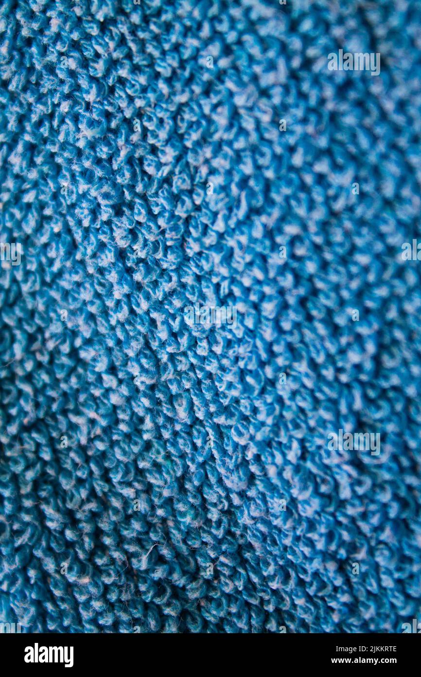 A vertical closeup texture of a blue wool carpet rug Stock Photo - Alamy
