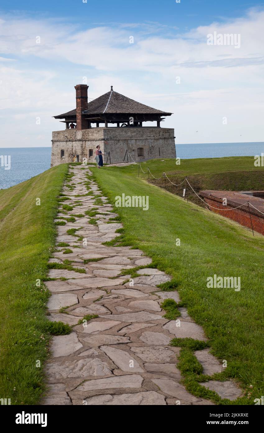 Stone lookout building sits on bluff and overlooks Lake Ontario. Old ...