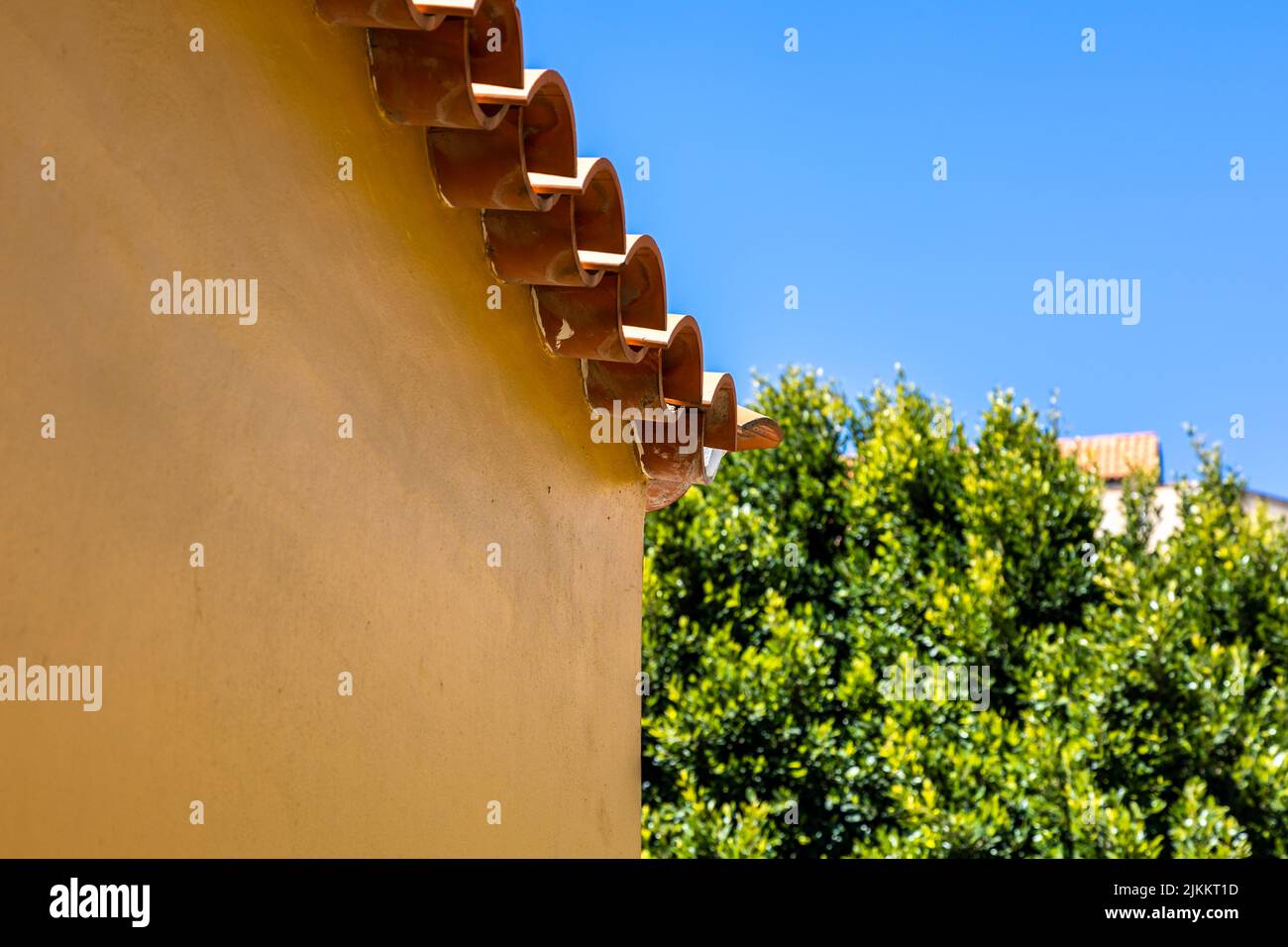 A low angle shot of a light brown stone building with circular rooftop ...