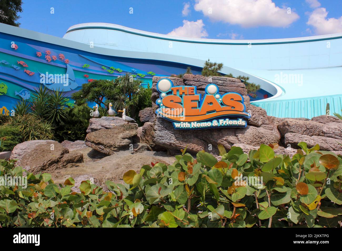 A bright summer day at The Seas with Nemo entrance at Walt Disney World ...