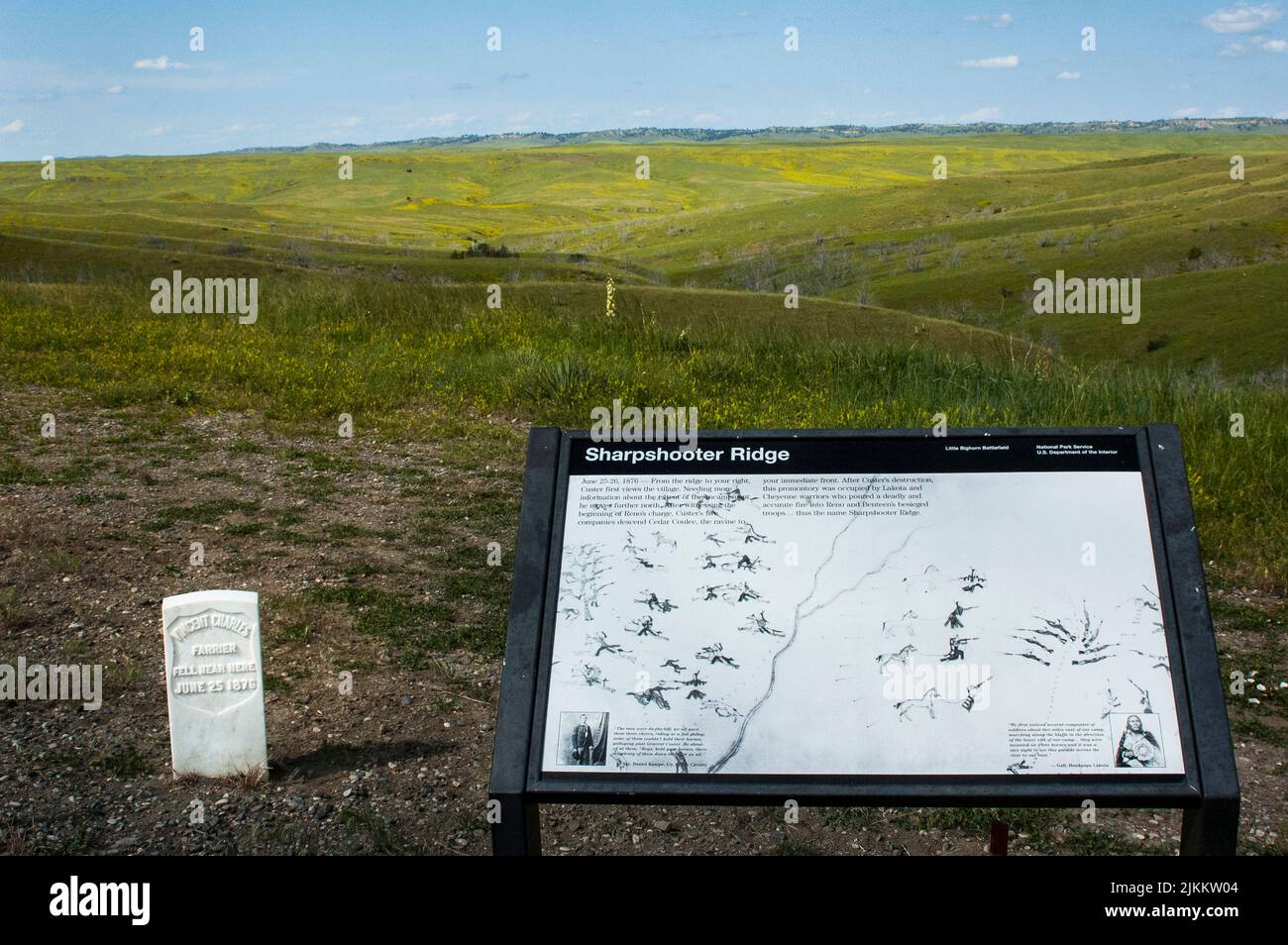 Interpretive sign and grave marker sit on Sharpshooter Ridge ...