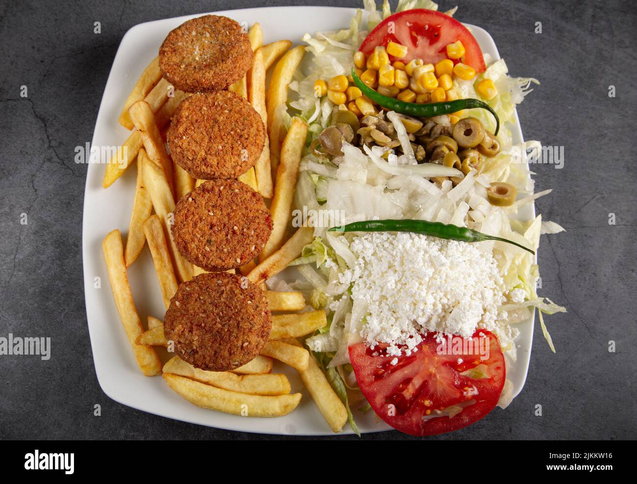 Traditional falafel platter with salad and chips Stock Photo - Alamy