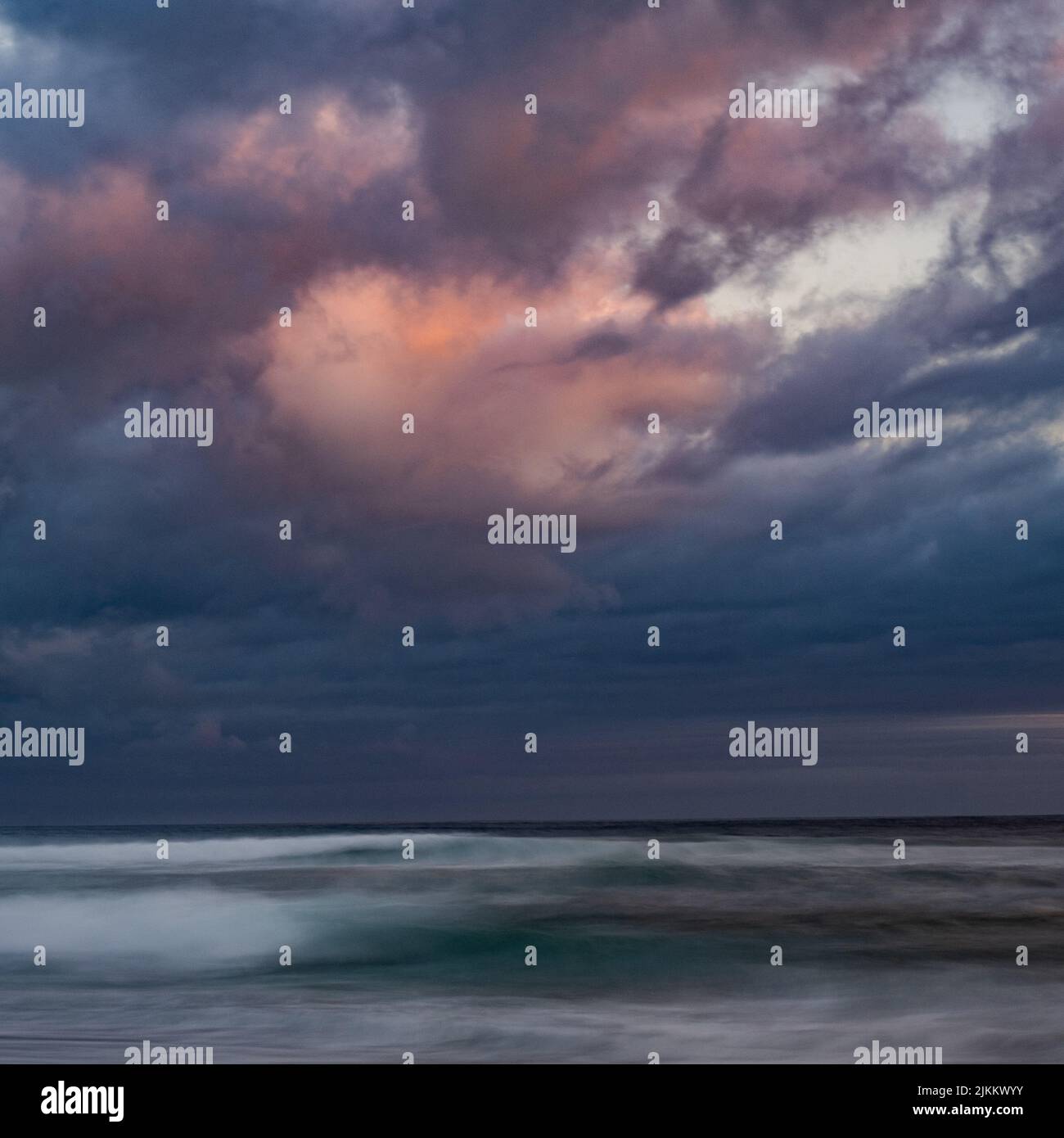 A breathtaking view of the colorful sunset clouds above the sea Stock ...