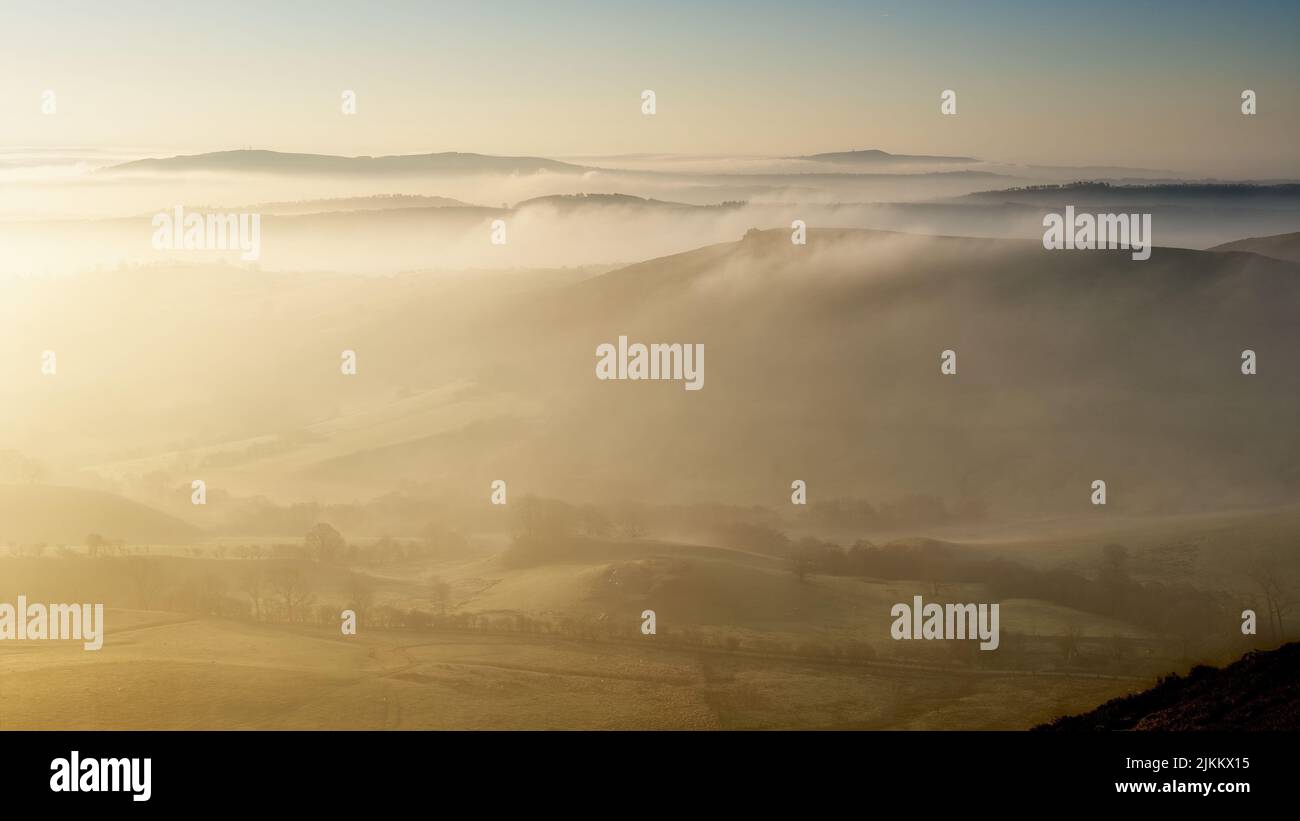 A beautiful view of Layers of mist over Willstone Hill, Shropshire, UK ...