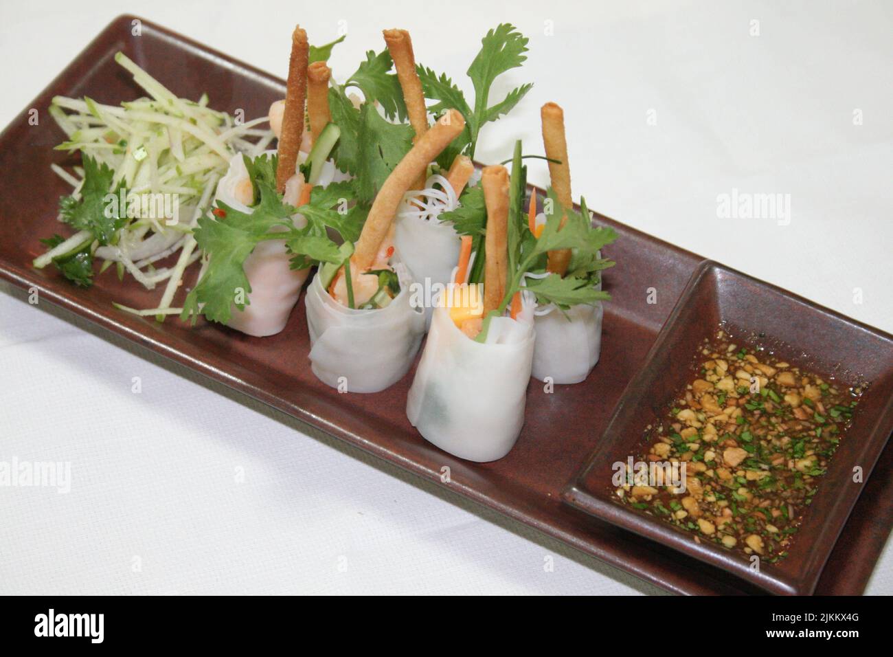 A spring roll dish on white background Stock Photo - Alamy