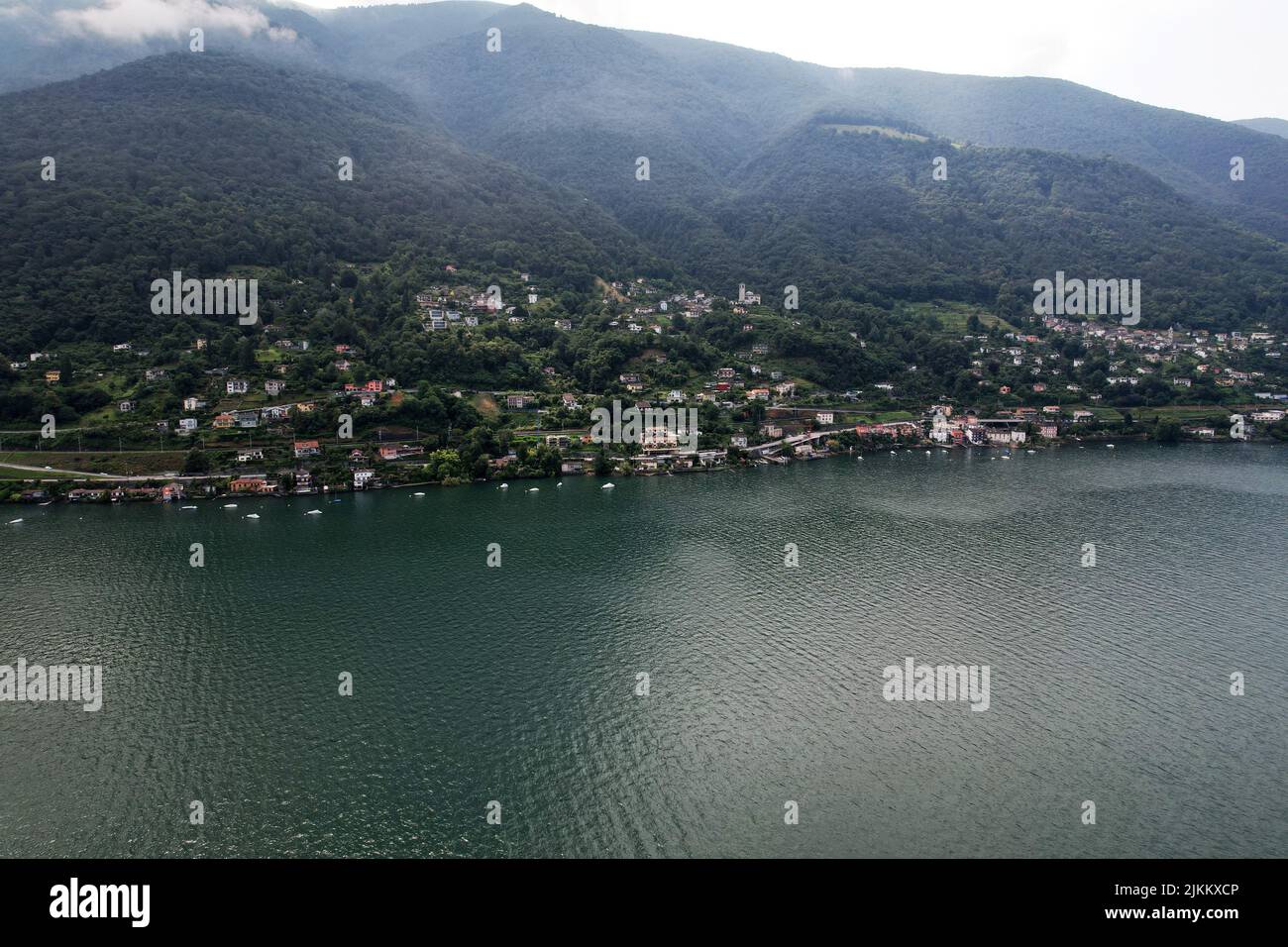 A bird's eye view of Sant Abbondio over Lago Maggiore lake and Locarno ...