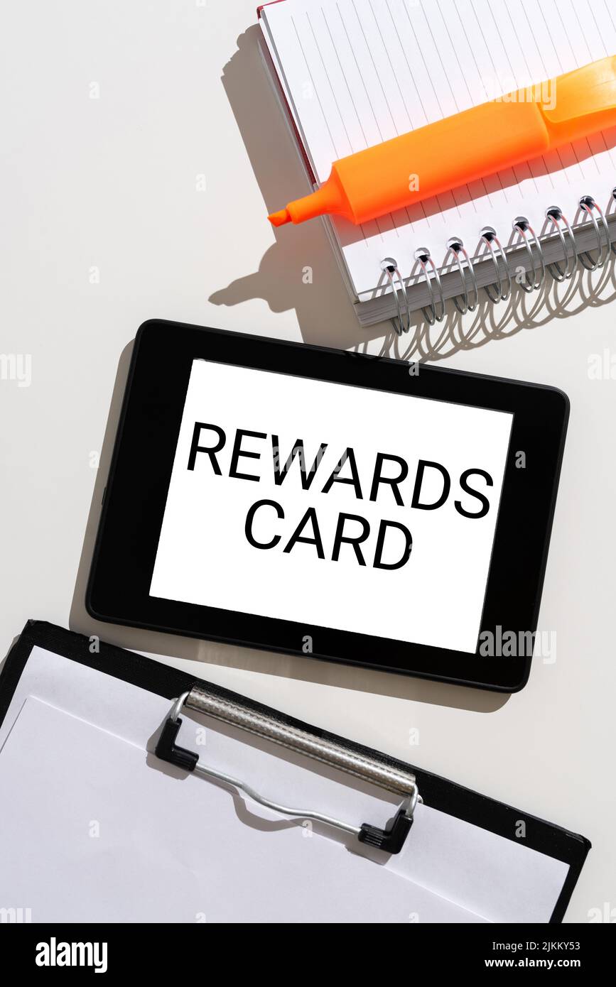 Sign displaying Rewards Card. Business showcase Help earn cash points ...