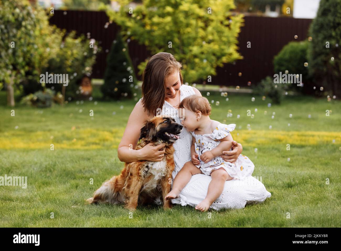 Family day, mother's day. Beautiful smiling young mom and baby daughter ...