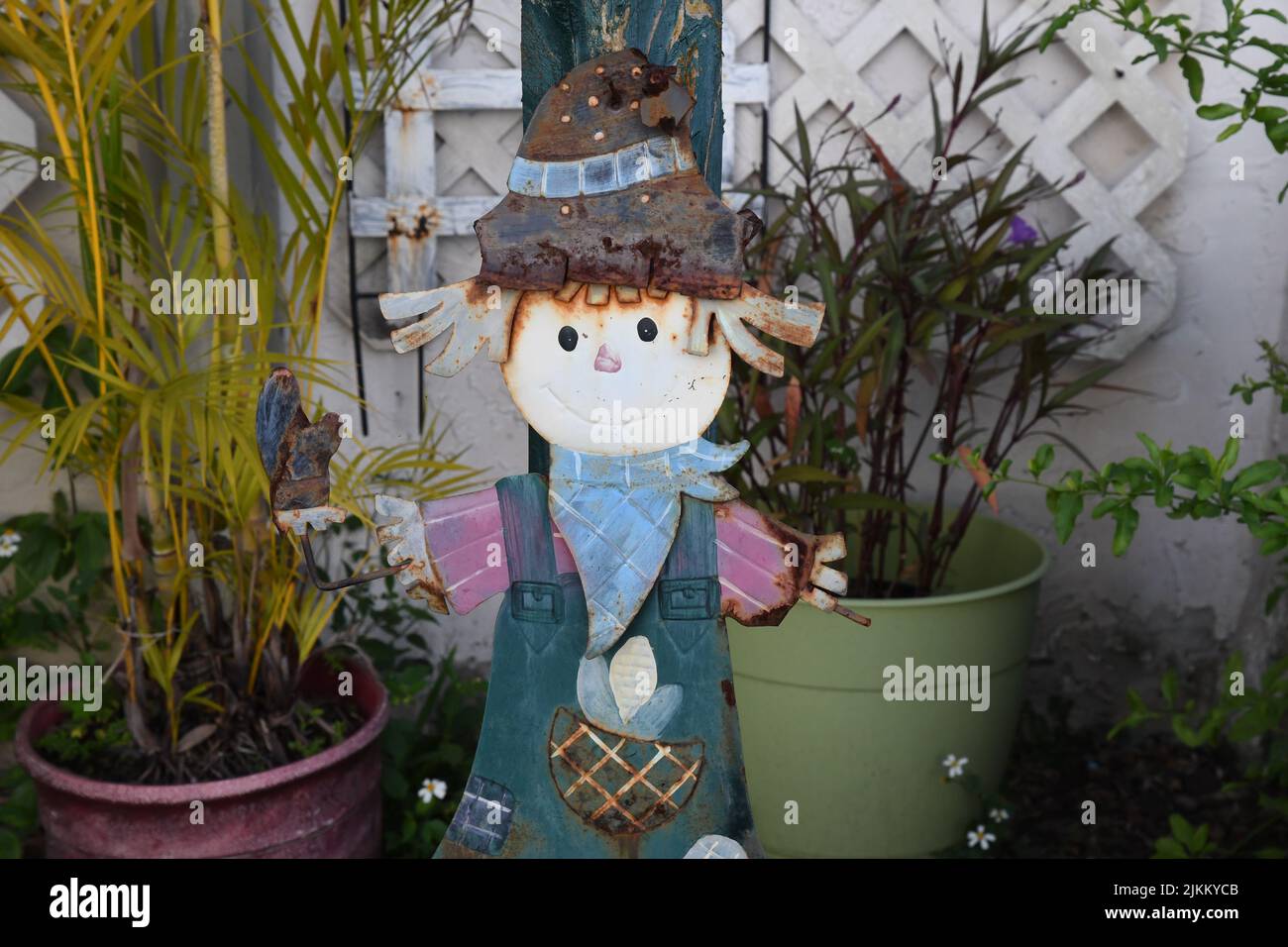 An old rusty boy toy with plants pots in the back in a garden Stock ...