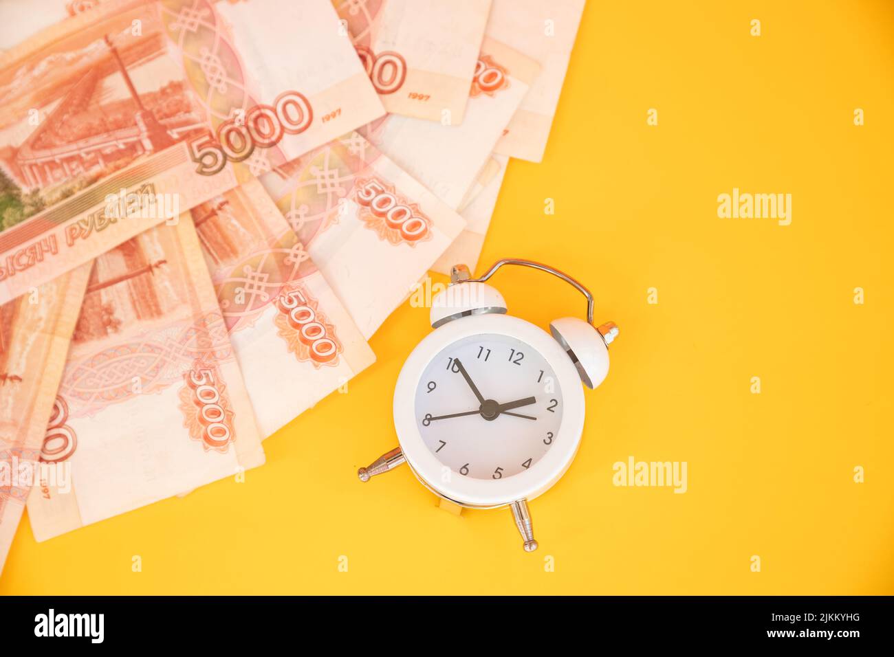 Time value of money concept, analog clock on US dollar banknote ...