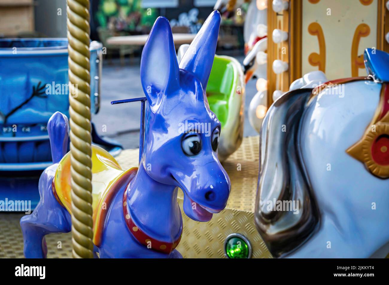 A donkey carousel at the fairground .The old carousel in the Park of ...