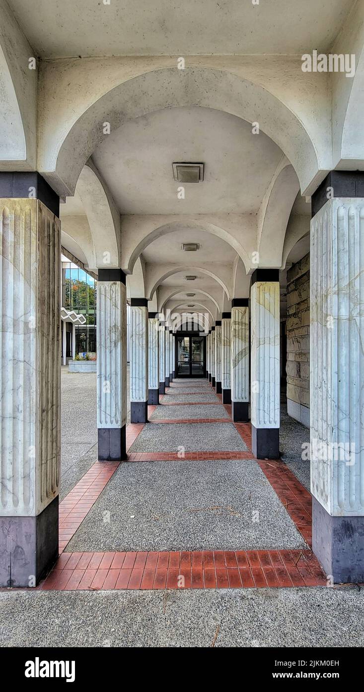 A vertical shot of arcade corridor of columns in Royal BC Museum in ...