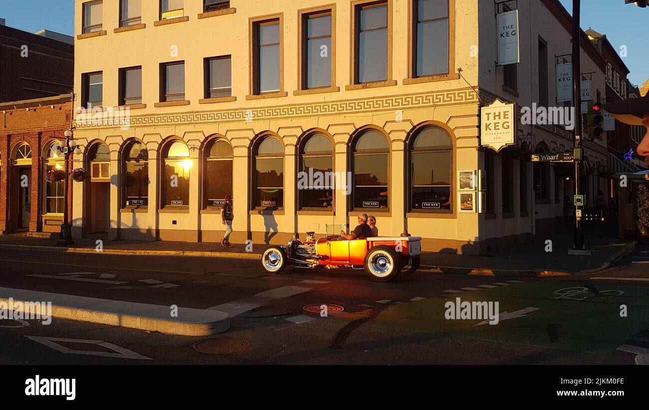 A beautiful shot of people driving in the downtown Victoria, Wharf ...