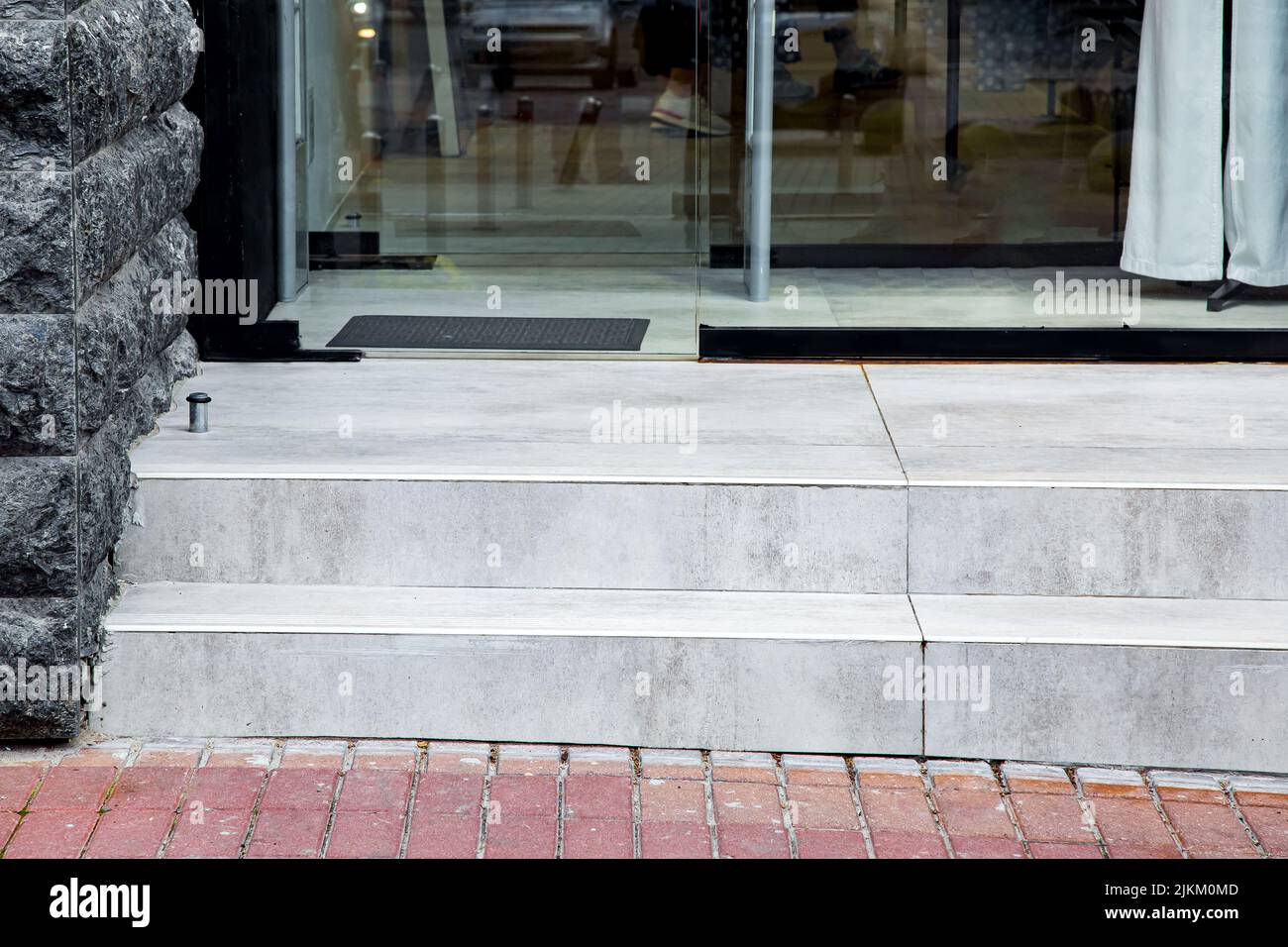 threshold from light gray ceramic tile with step at entrance to the ...