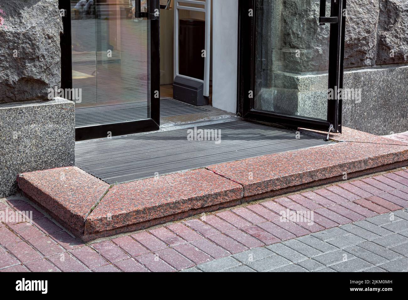 entrance with granite threshold to store from pedestrian sidewalk from ...