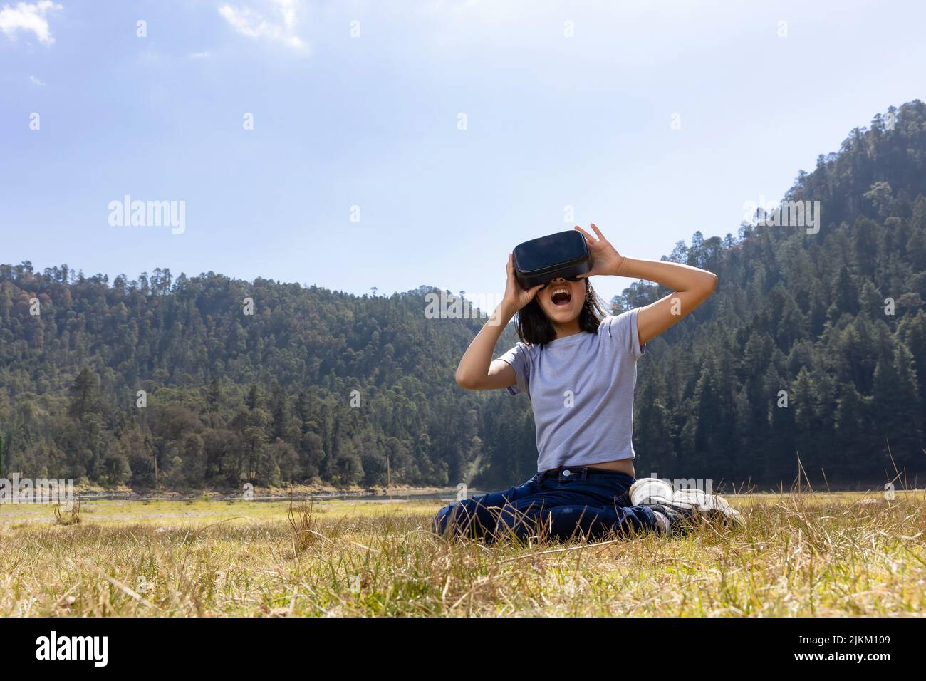 Mexican teenager wear vr glasses outside mexico metaverse concept Stock ...