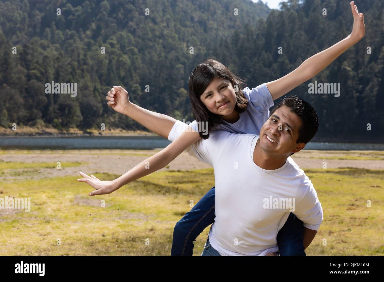 spanish father and daughter playing outdoors Stock Photo - Alamy
