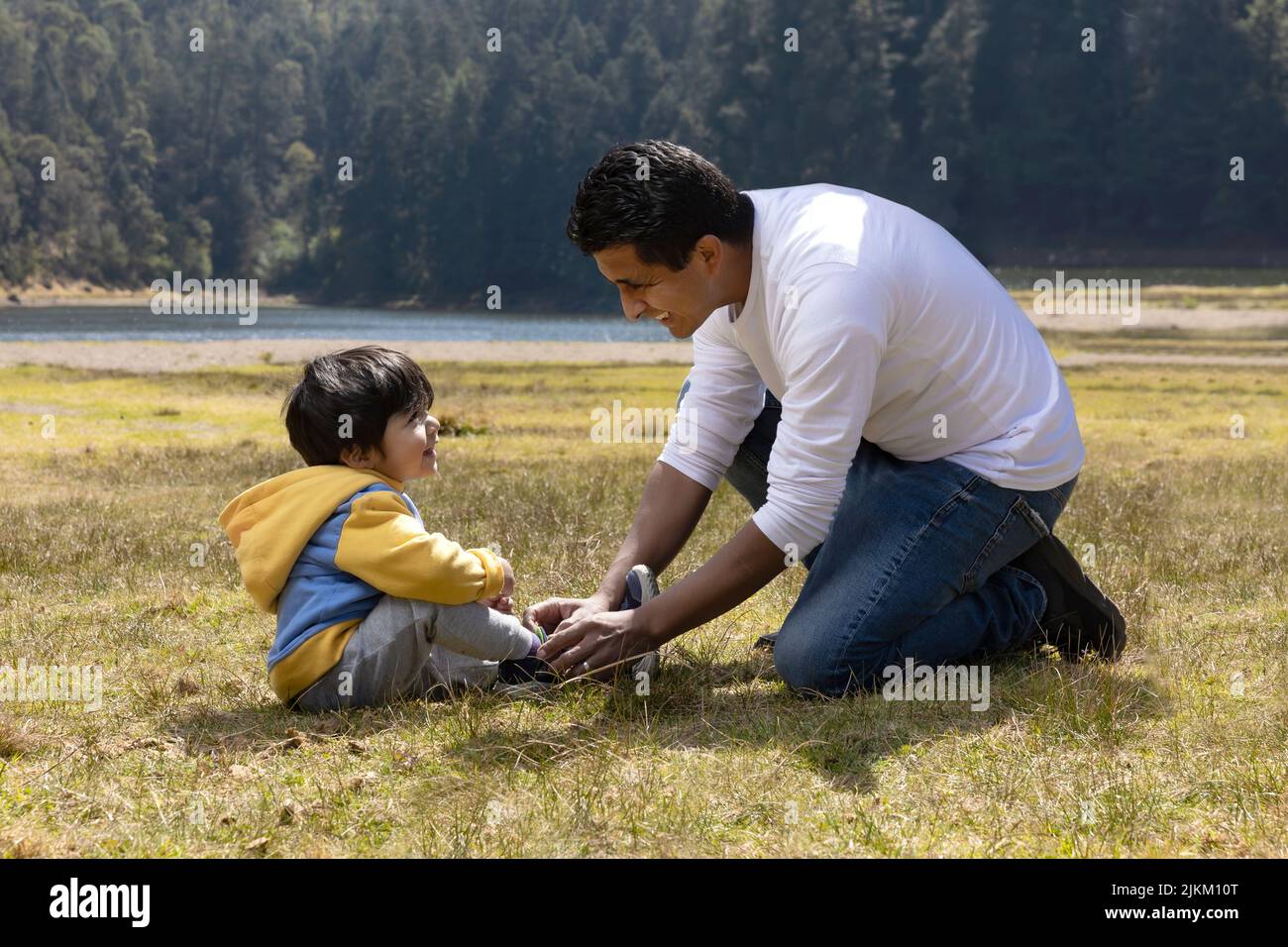 Mexican father and son having fun outdoors Stock Photo - Alamy