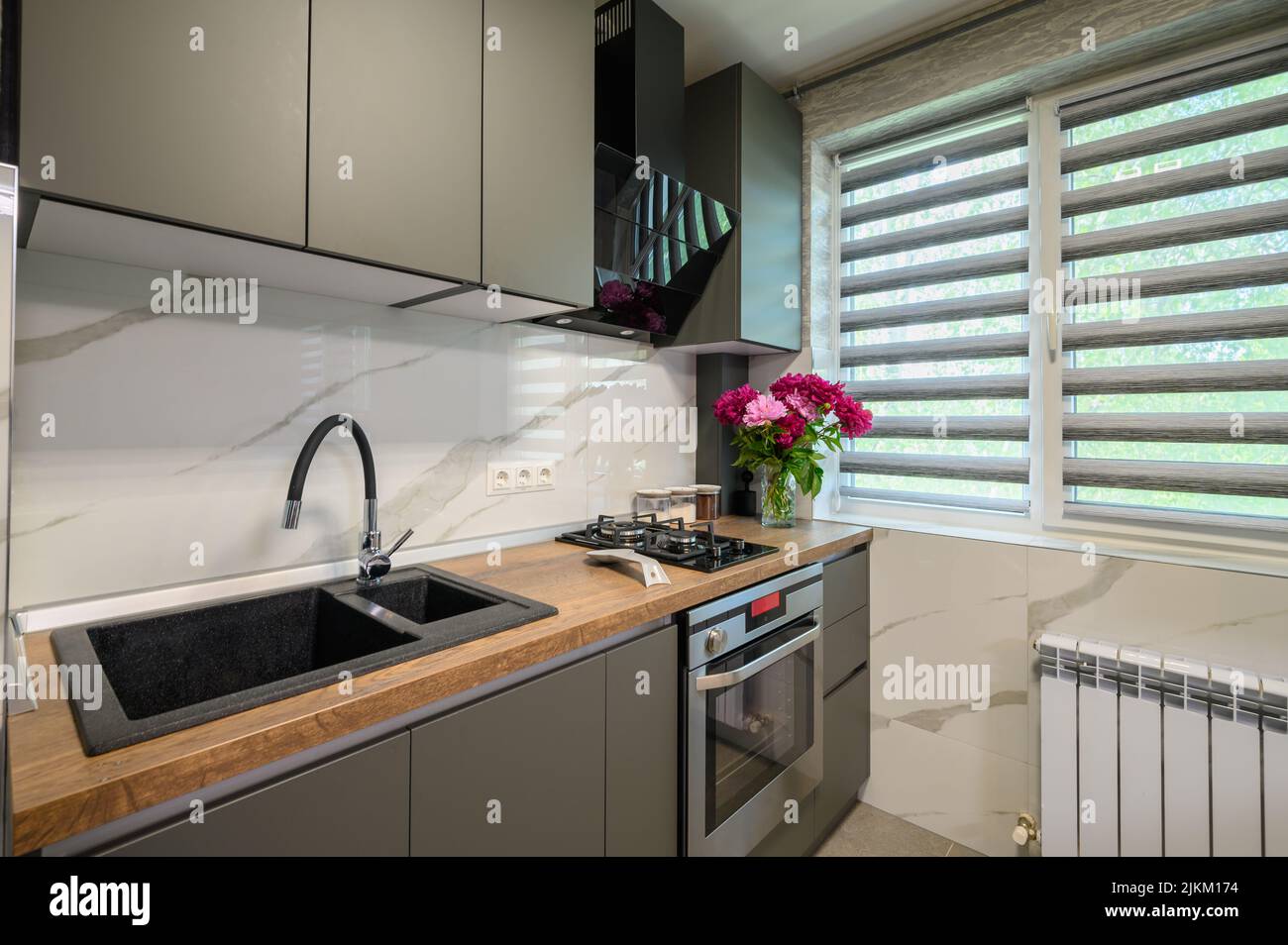 Interior of modern trendy grey kitchen Stock Photo - Alamy