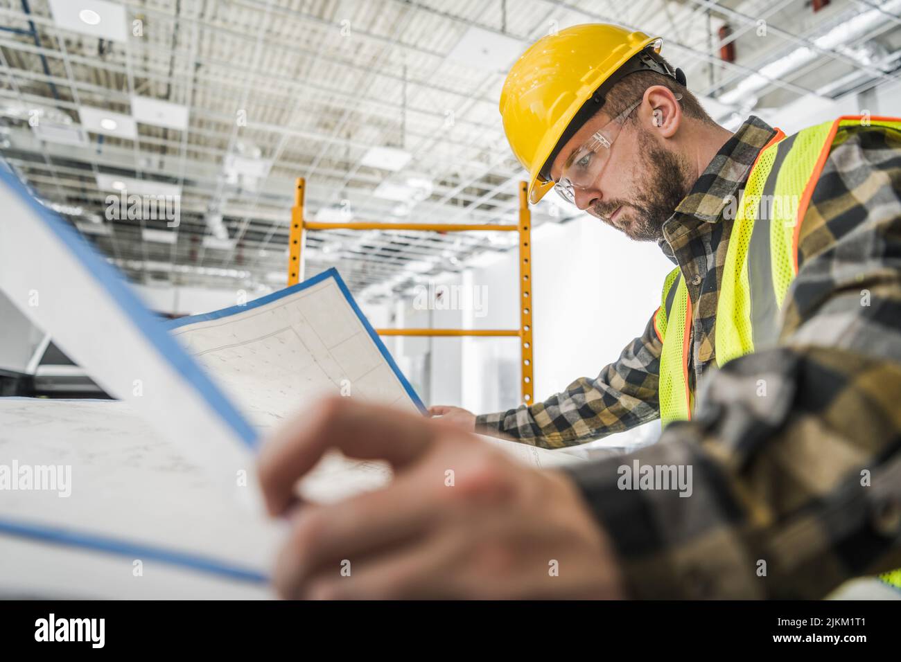 Commercial Building Development. Caucasian Construction Site Supervisor ...