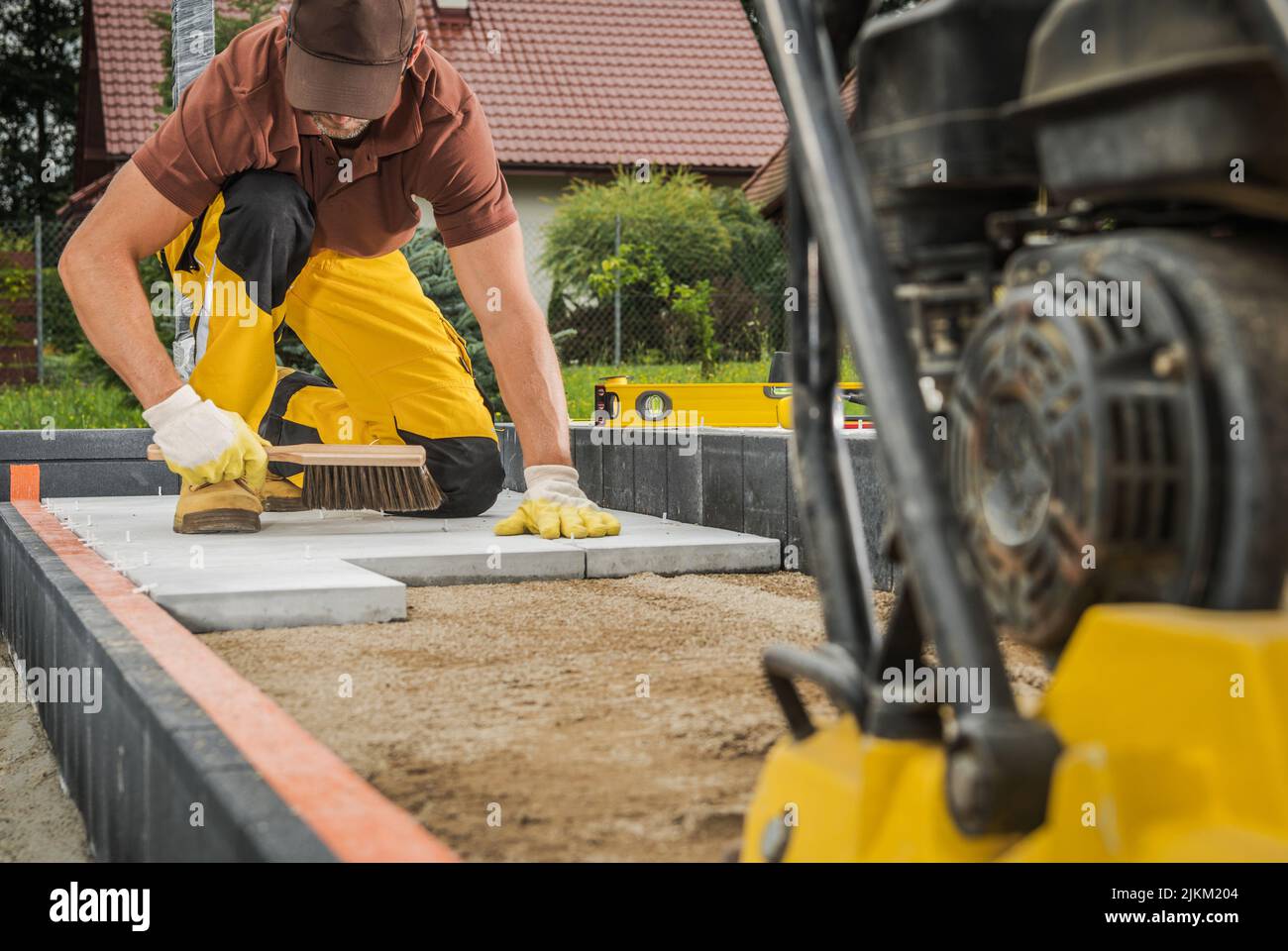Residential Pathway Concrete Bricks Paving by Caucasian Worker ...