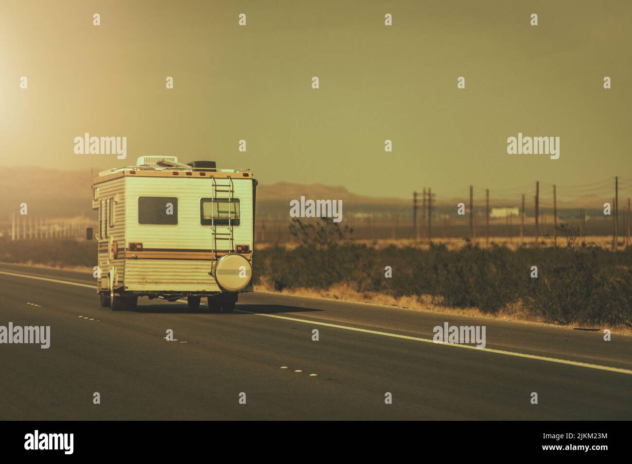 RV Road Trip. Vintage Aged Camper Van on a Highway. Recreational ...