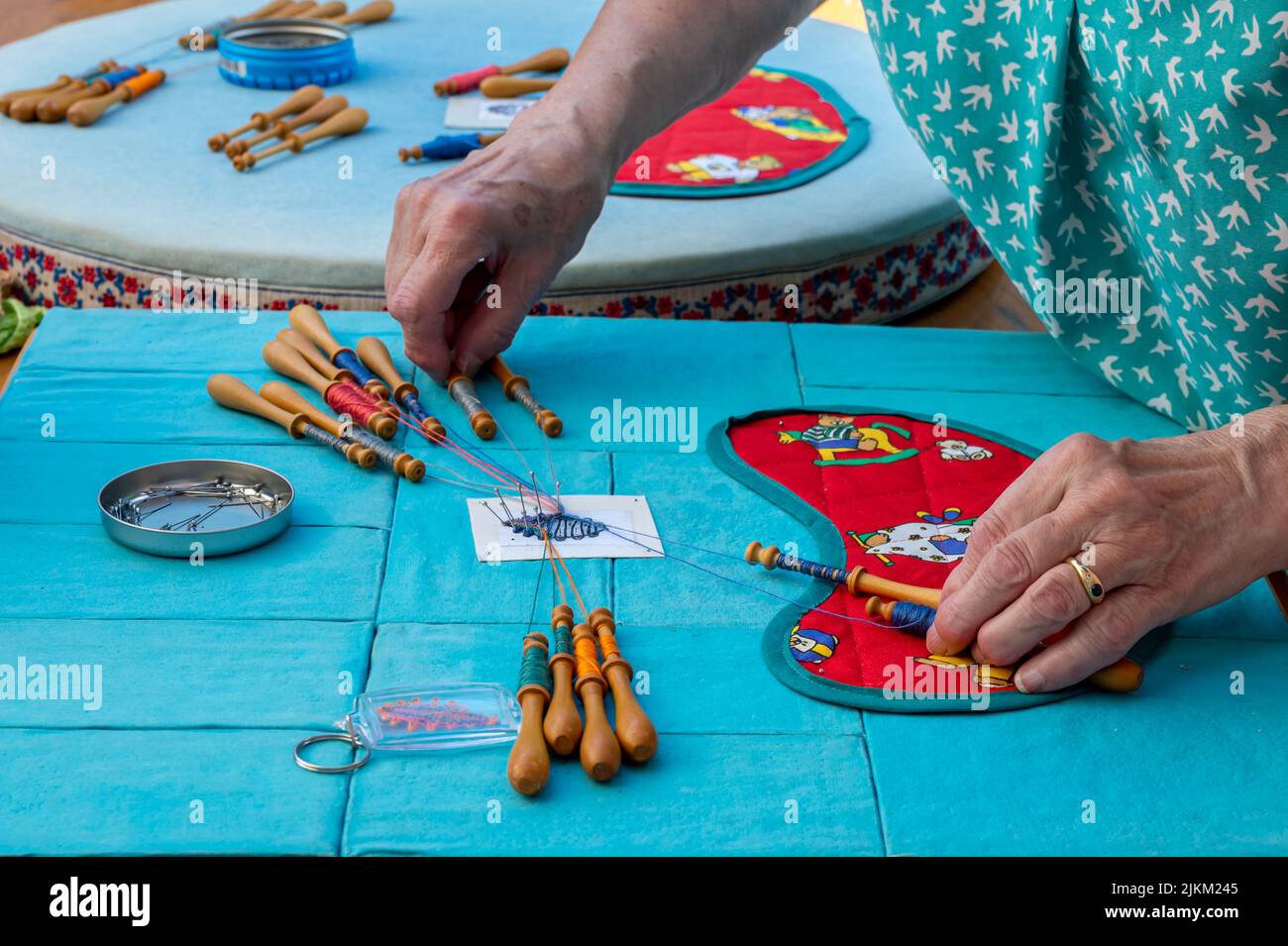 Hands of woman making bobbin lace. Colorful lace threads. Handmake ...