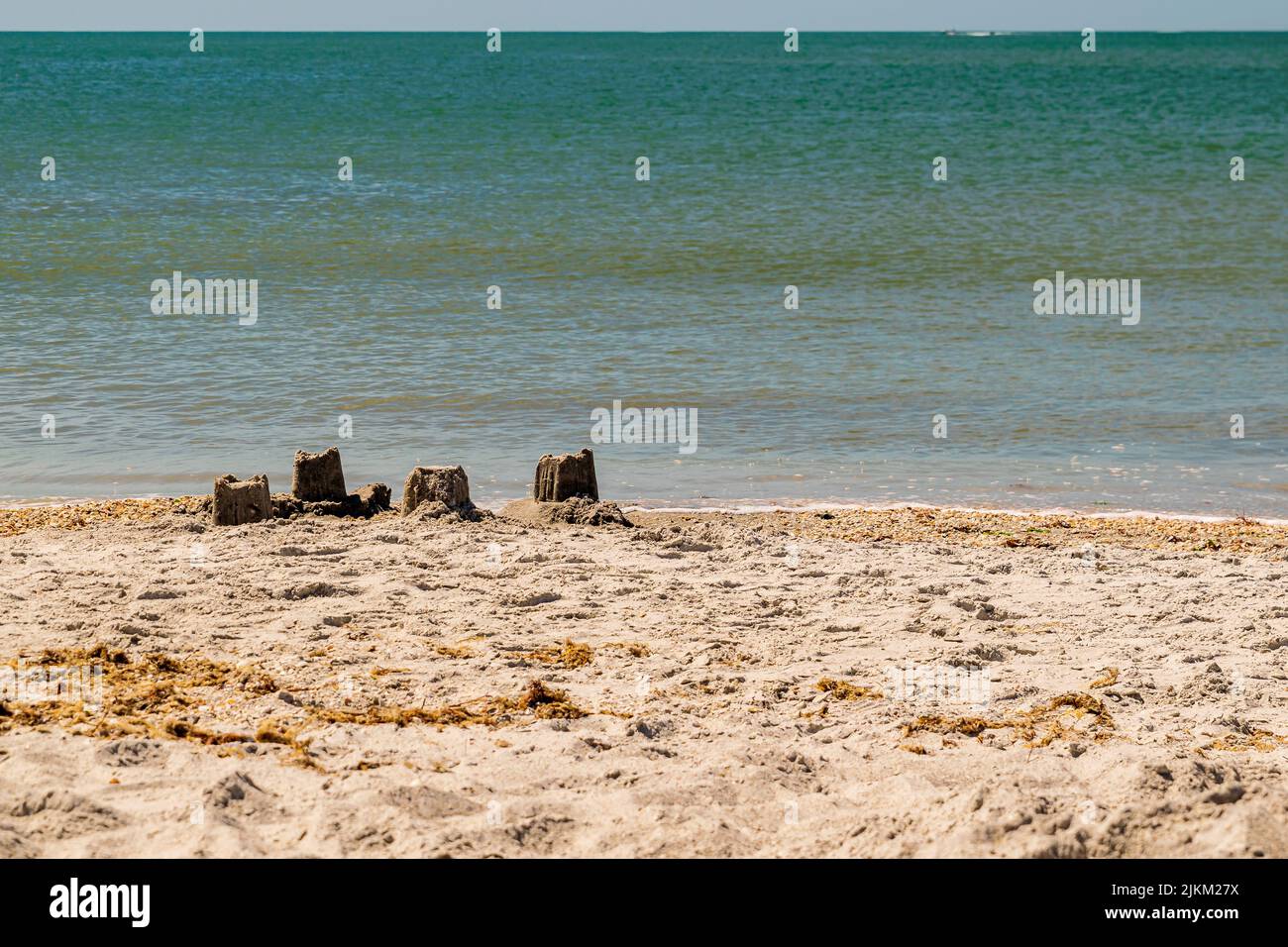 A natural view of sandcastles on the beach of Florida, USA Stock Photo ...