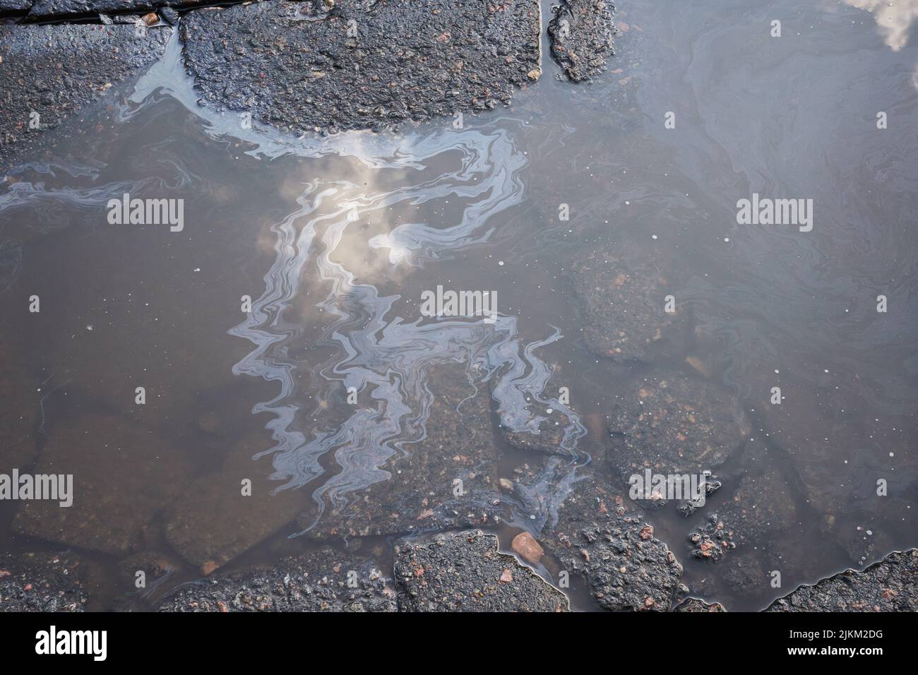 Oil rainbow in puddle hi-res stock photography and images - Alamy