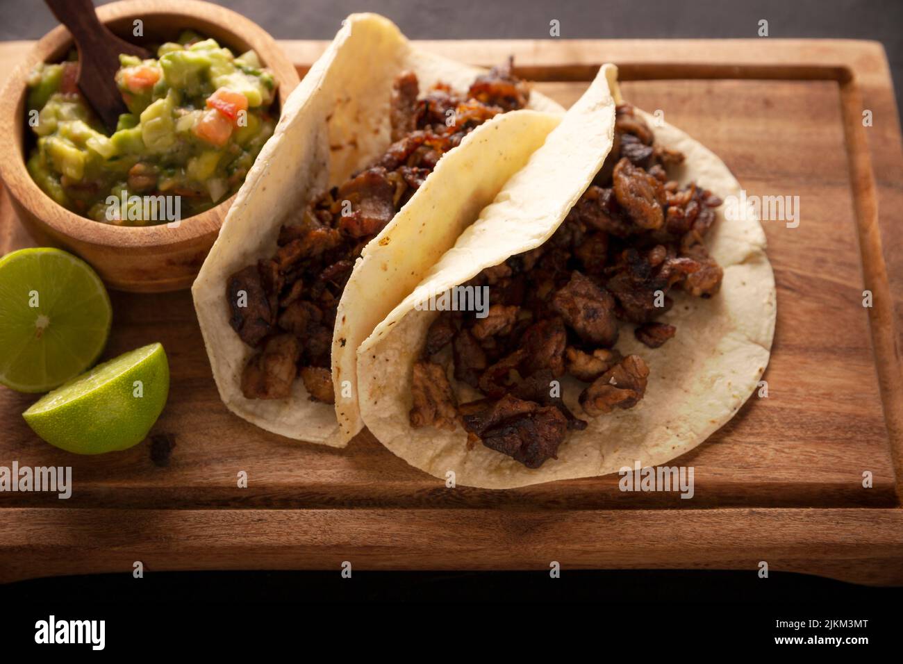 Tacos de Bistec. Homemade grilled meat in a corn tortilla. Street food ...