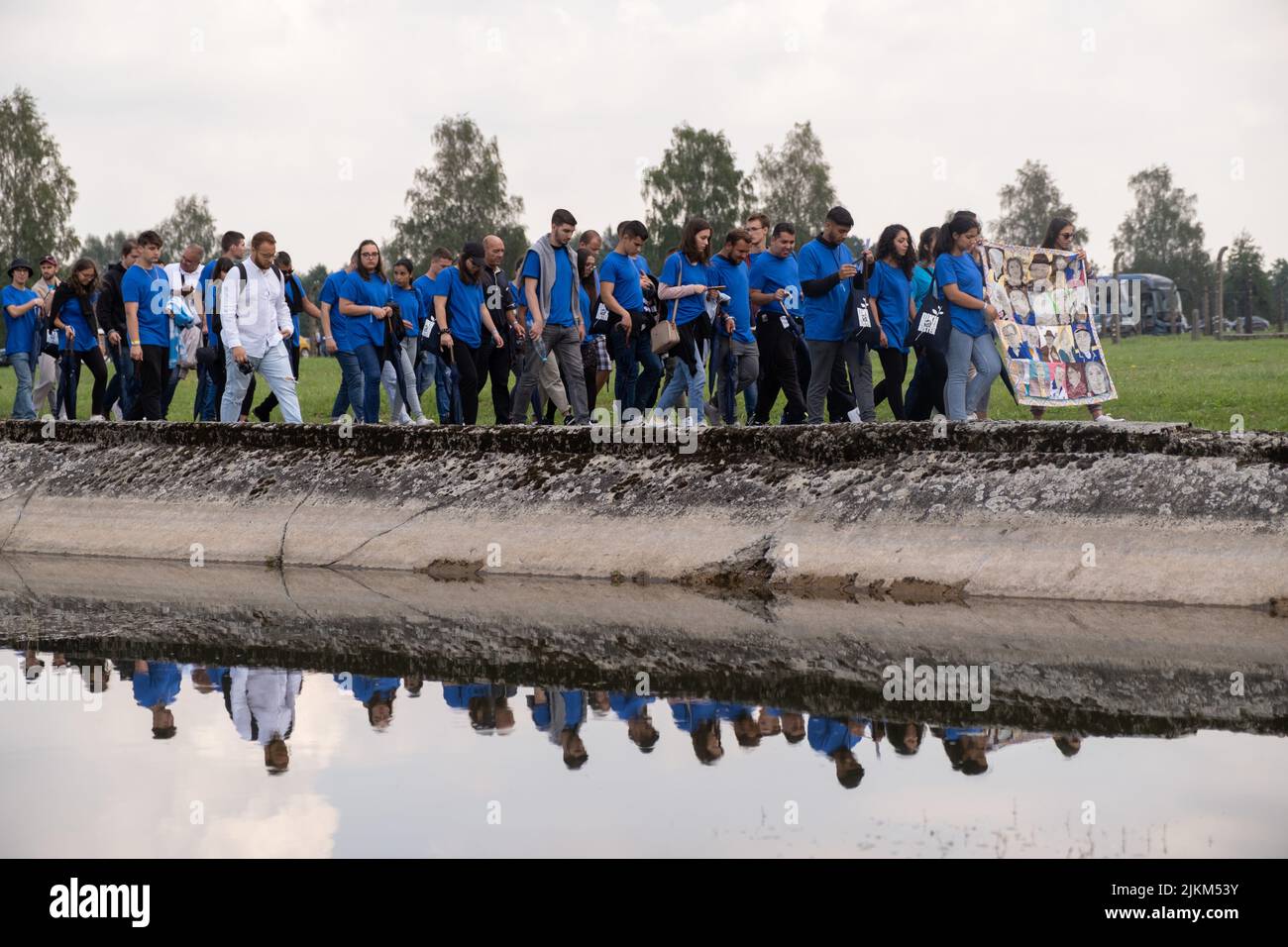 Brzezinka, Poland. 02nd Aug, 2022. A group of Gypsies holding a poster ...
