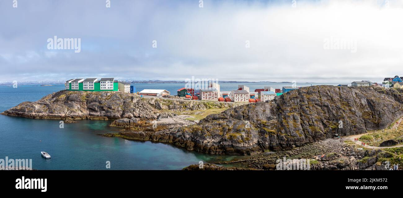 Panoramic view of colourful buildings perched on rocky outcrop into the ...