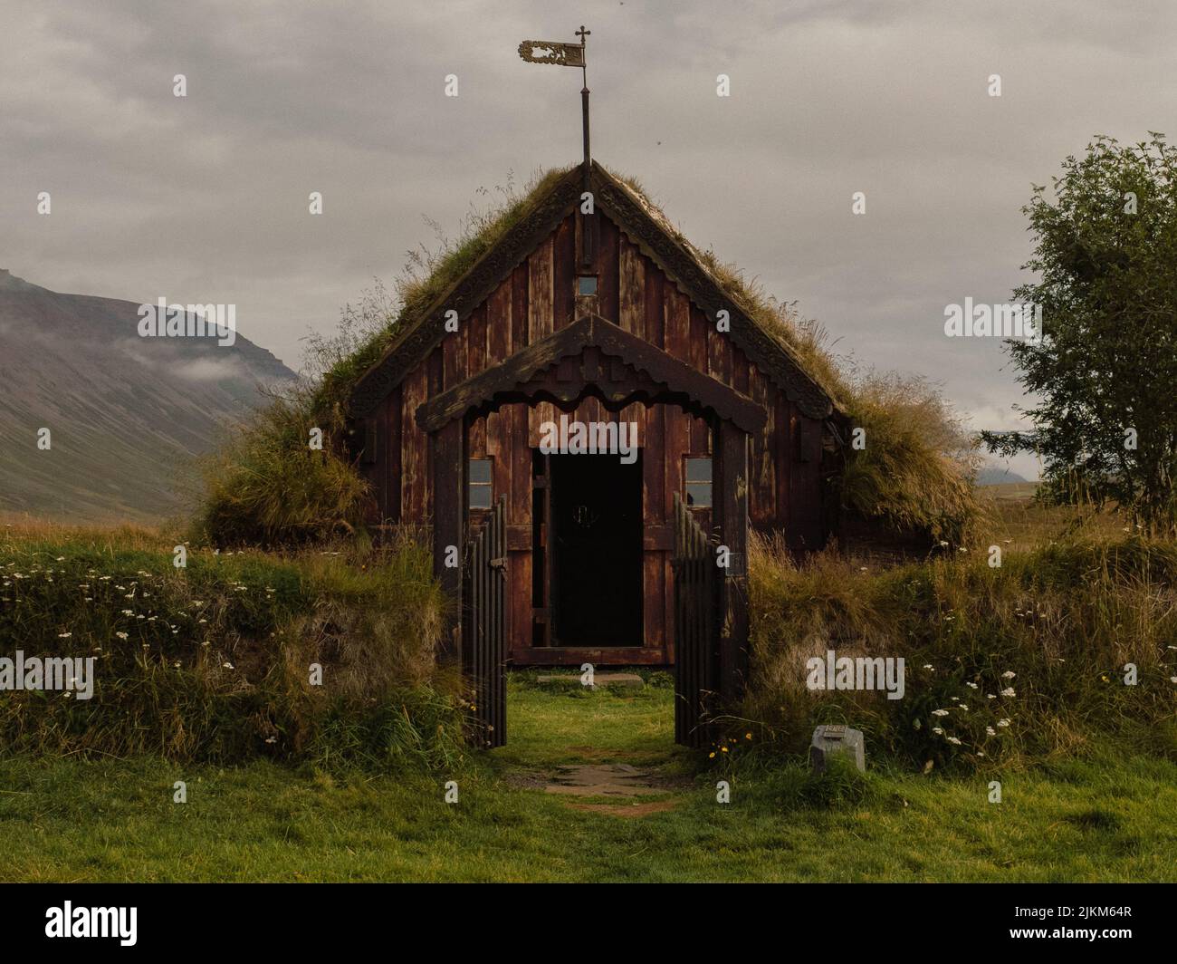 A small wooden hut in the field in foot of mountains in Iceland Stock ...