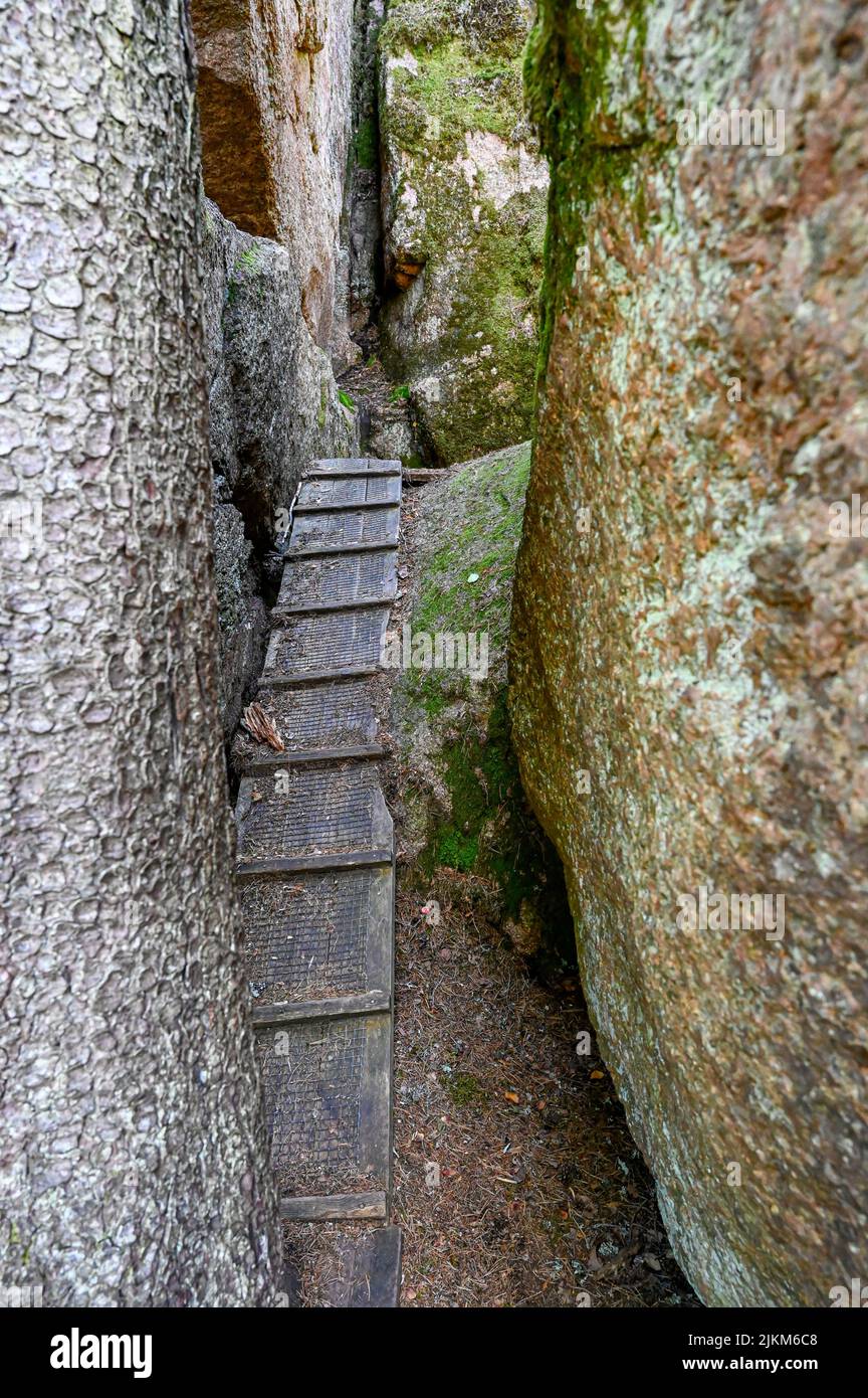wooden steps on trail between big rocks Stock Photo - Alamy
