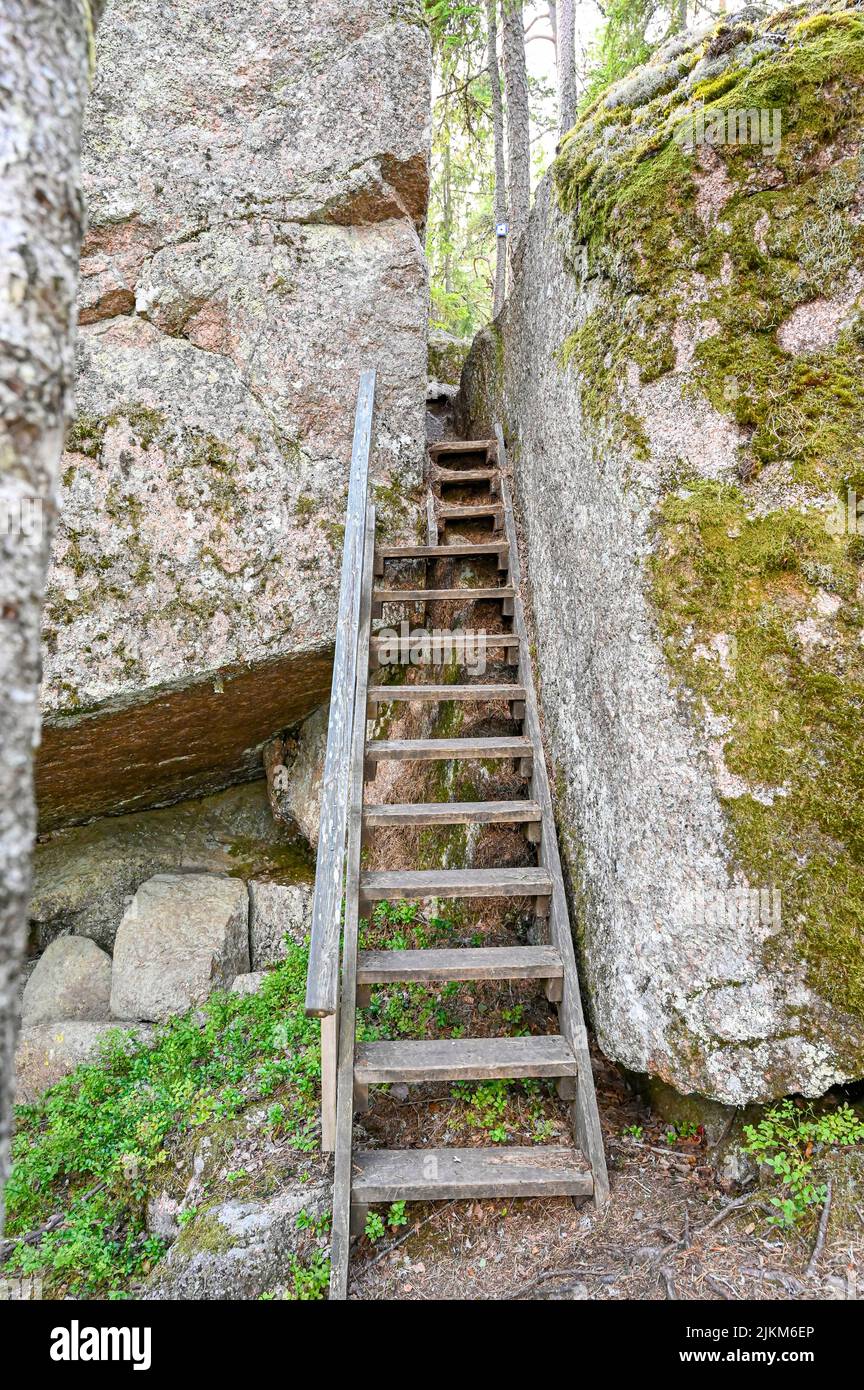 wooden steps on trail between big rocks Stock Photo - Alamy