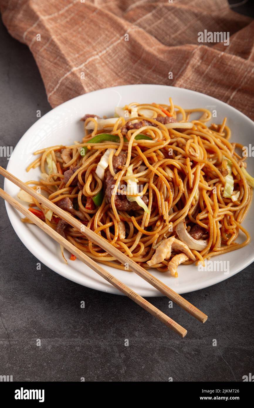 Noodles three delights. Typical dish of Chinese food Stock Photo - Alamy