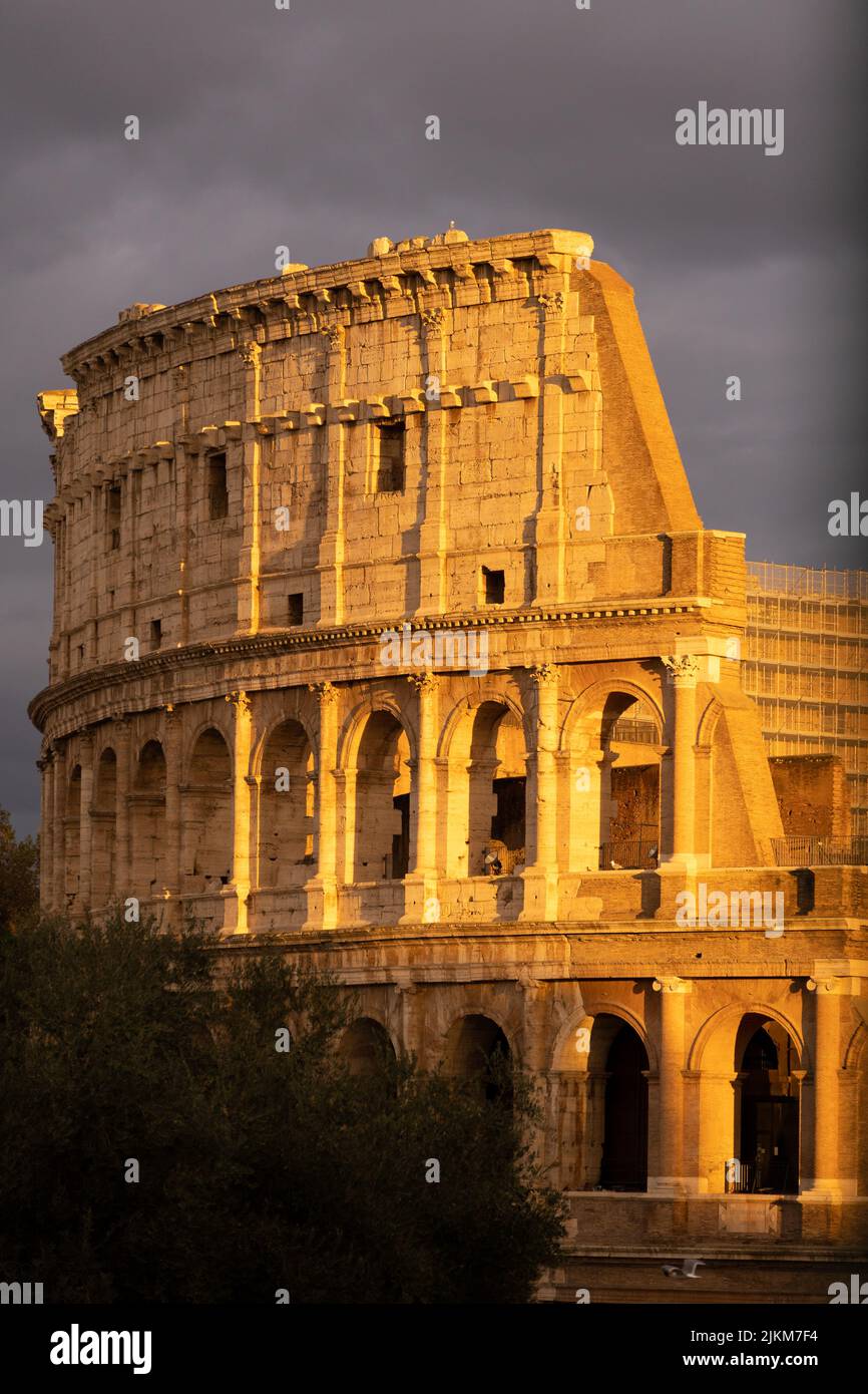 The Roman Coliseum illuminated by the sunset sun Stock Photo - Alamy