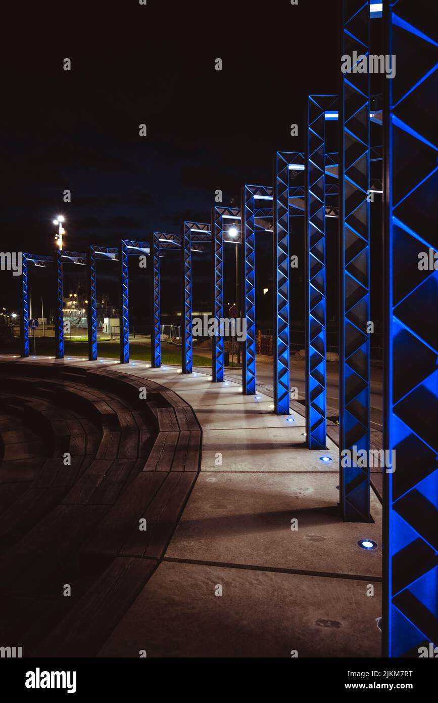 The illuminated metallic structures on the ground at night Stock Photo ...