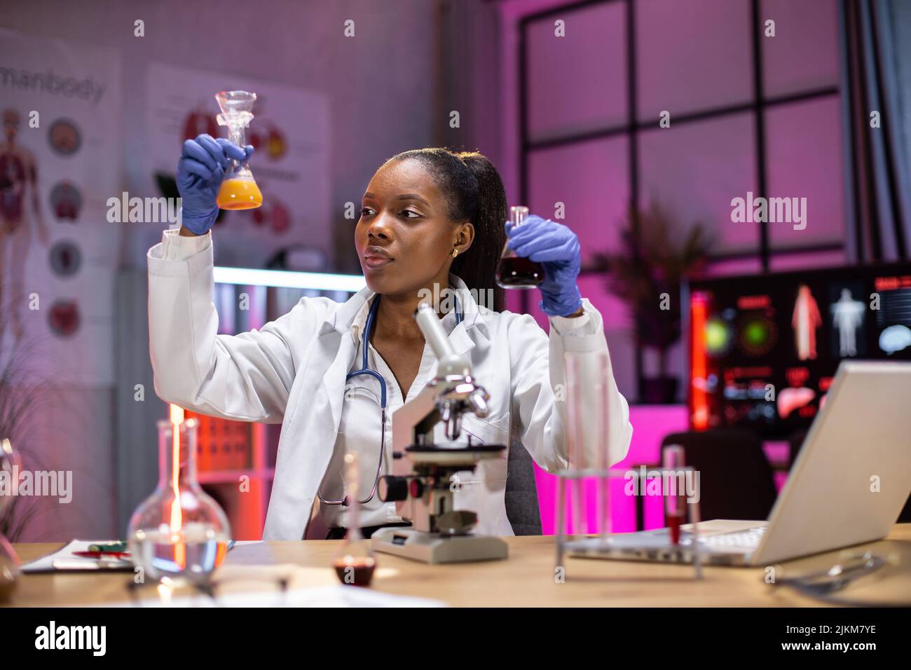 Female scientist working in modern lab. Doctor making microbiology ...