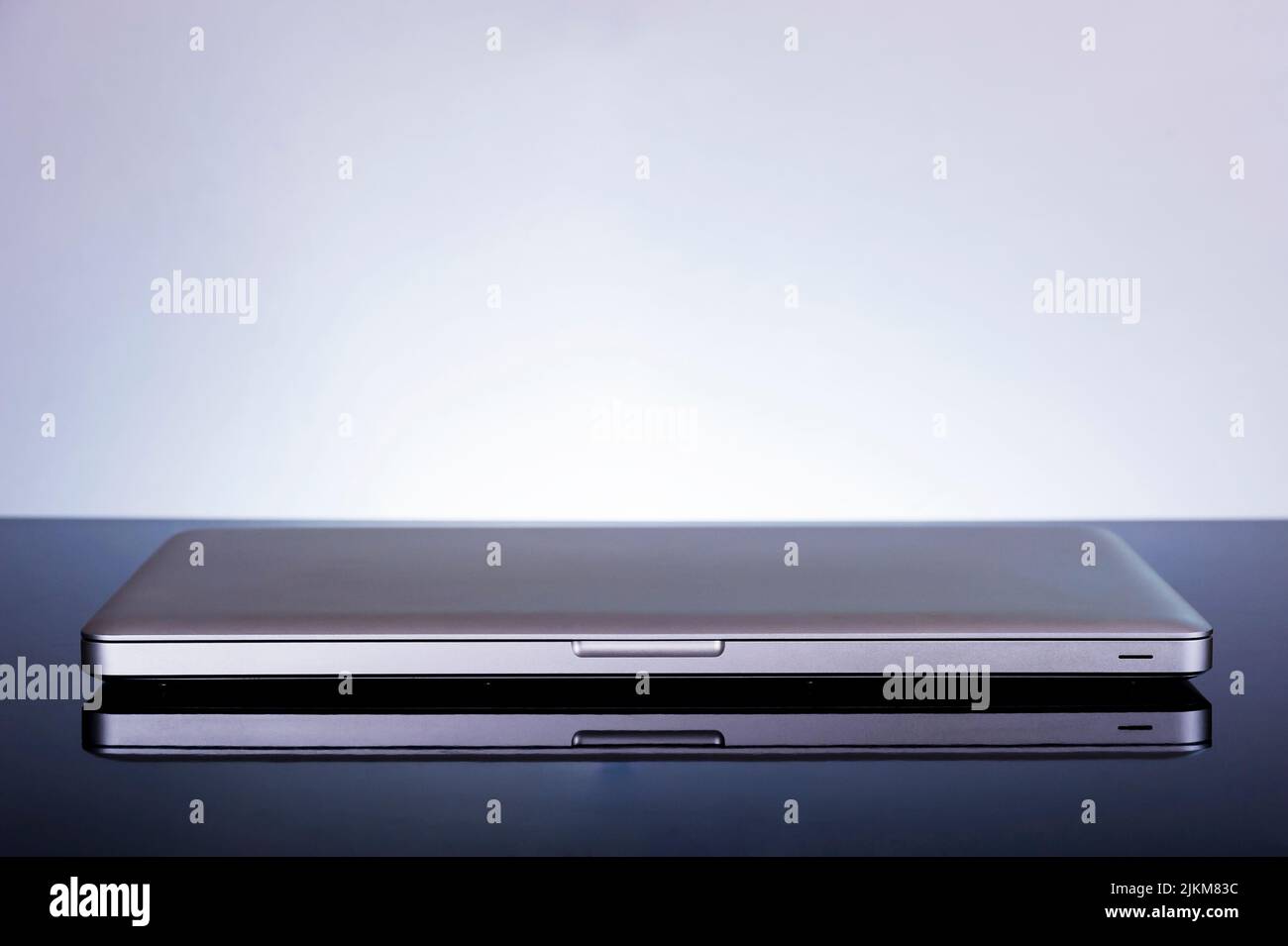 Back to school concept, laptop on reflective surface Stock Photo - Alamy