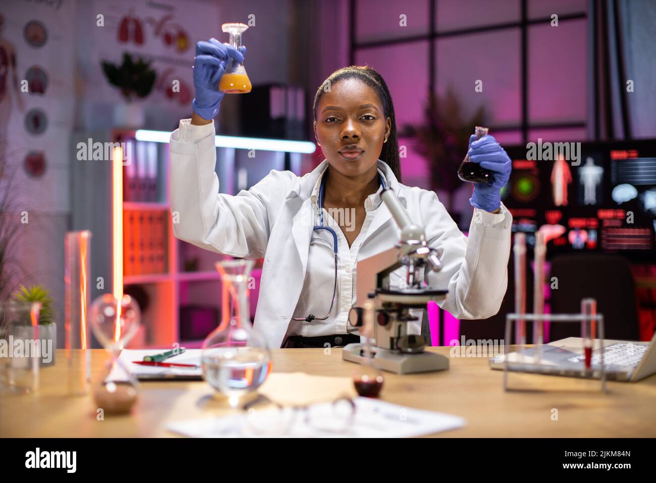 Modern medical research laboratory: african american female scientist ...