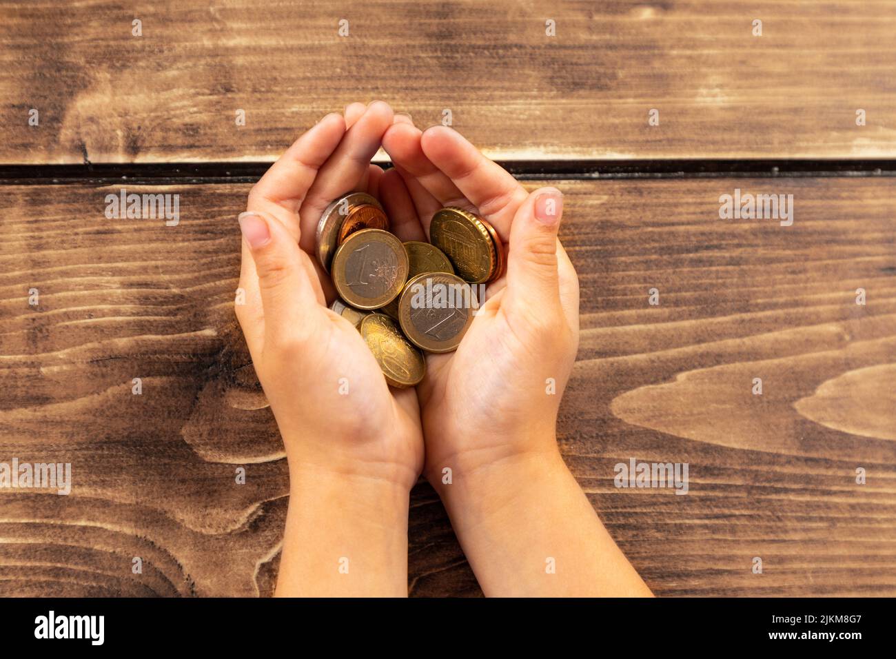Woman hands counting coins hi-res stock photography and images - Alamy