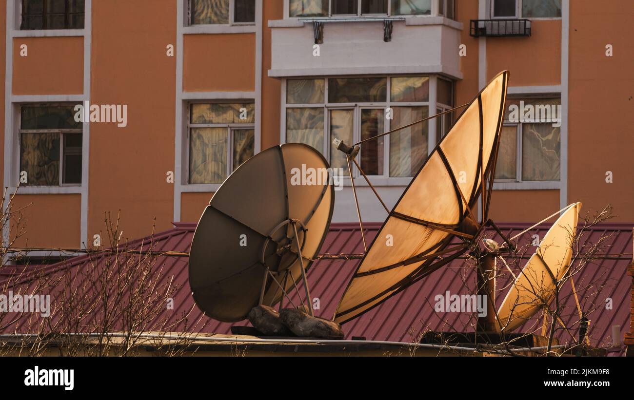 The satellite dishes on the rooftops of buildings in France Stock Photo ...