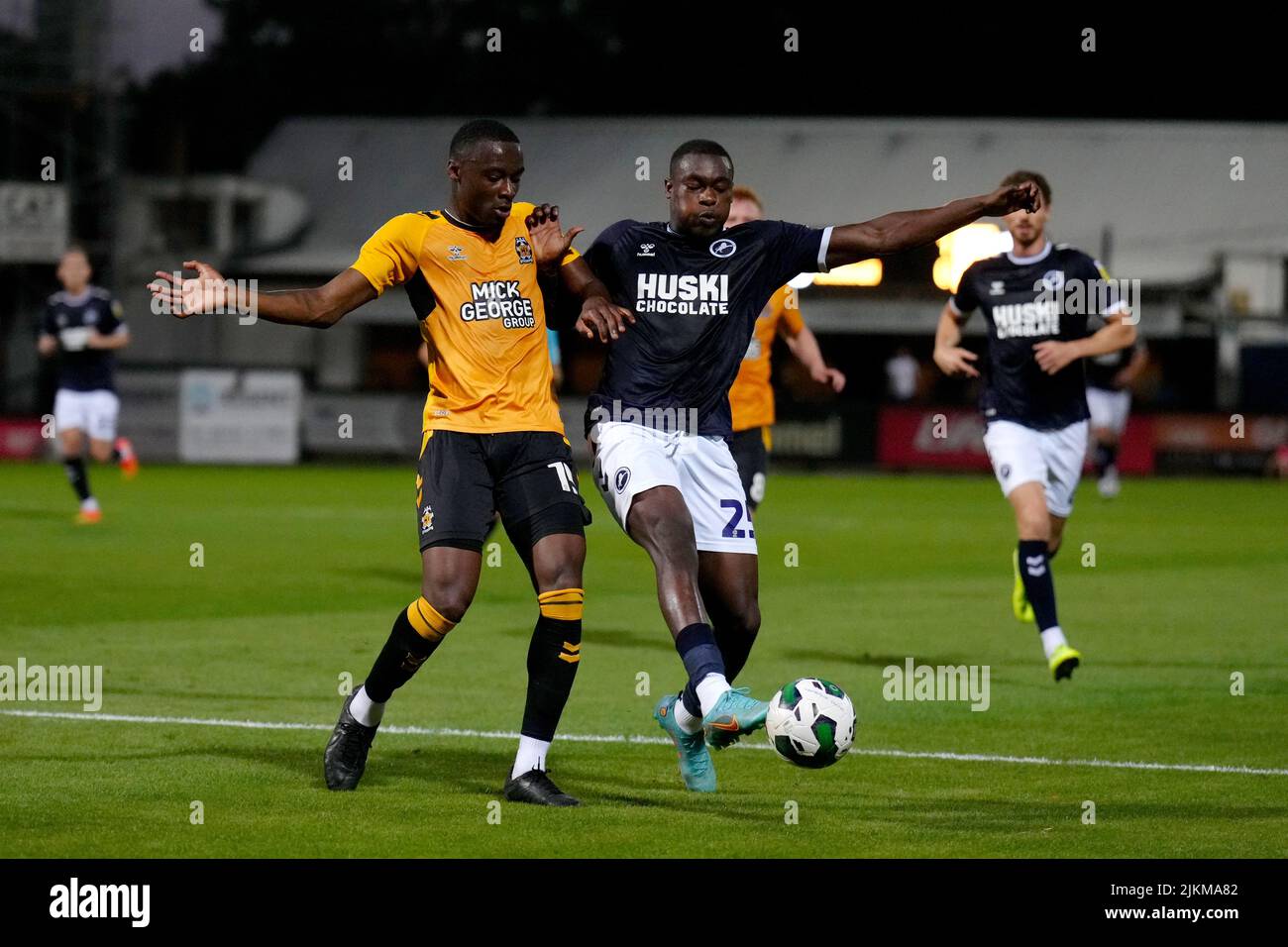 Cambridge United's Jubril Okedina, (left) battles for possession of the ...