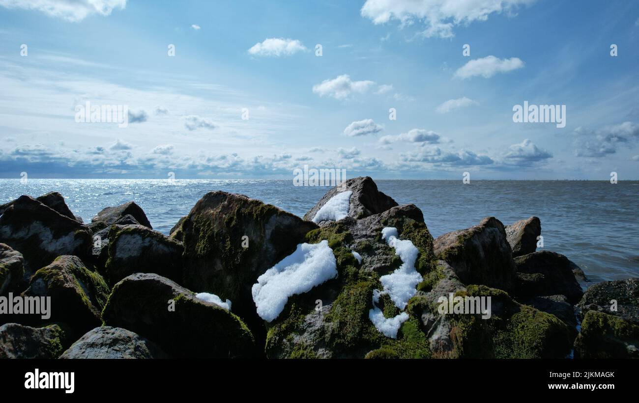 A scenic view of rocks covered in moss in the Netherlands with the ...