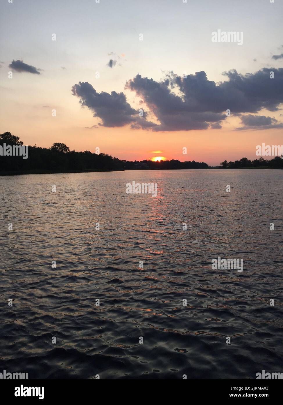 A vertical shot of a bright sunset sky over Delaware River Stock Photo ...