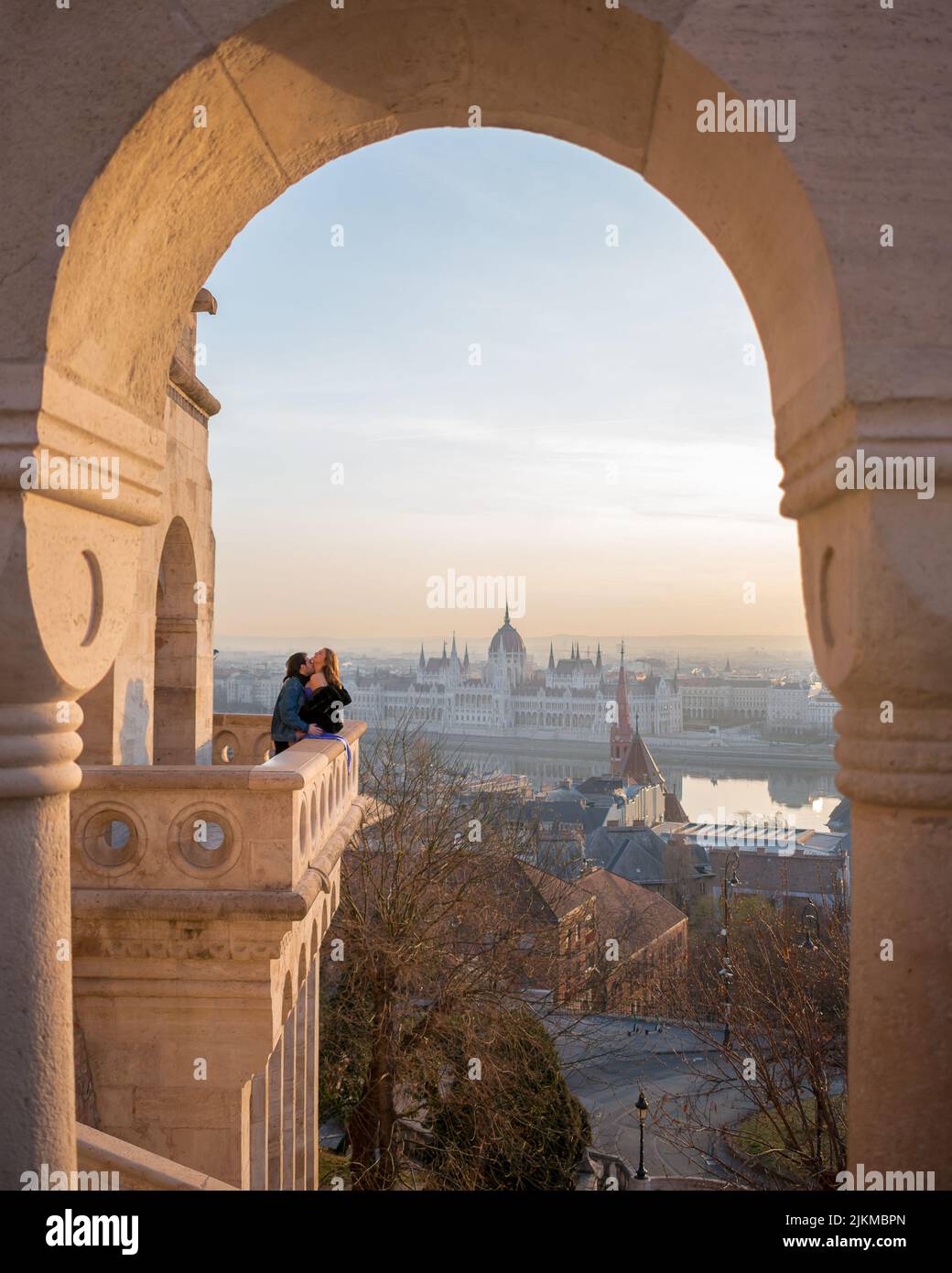 A romantic couple on the Parliament balcony in the city of Budapest ...