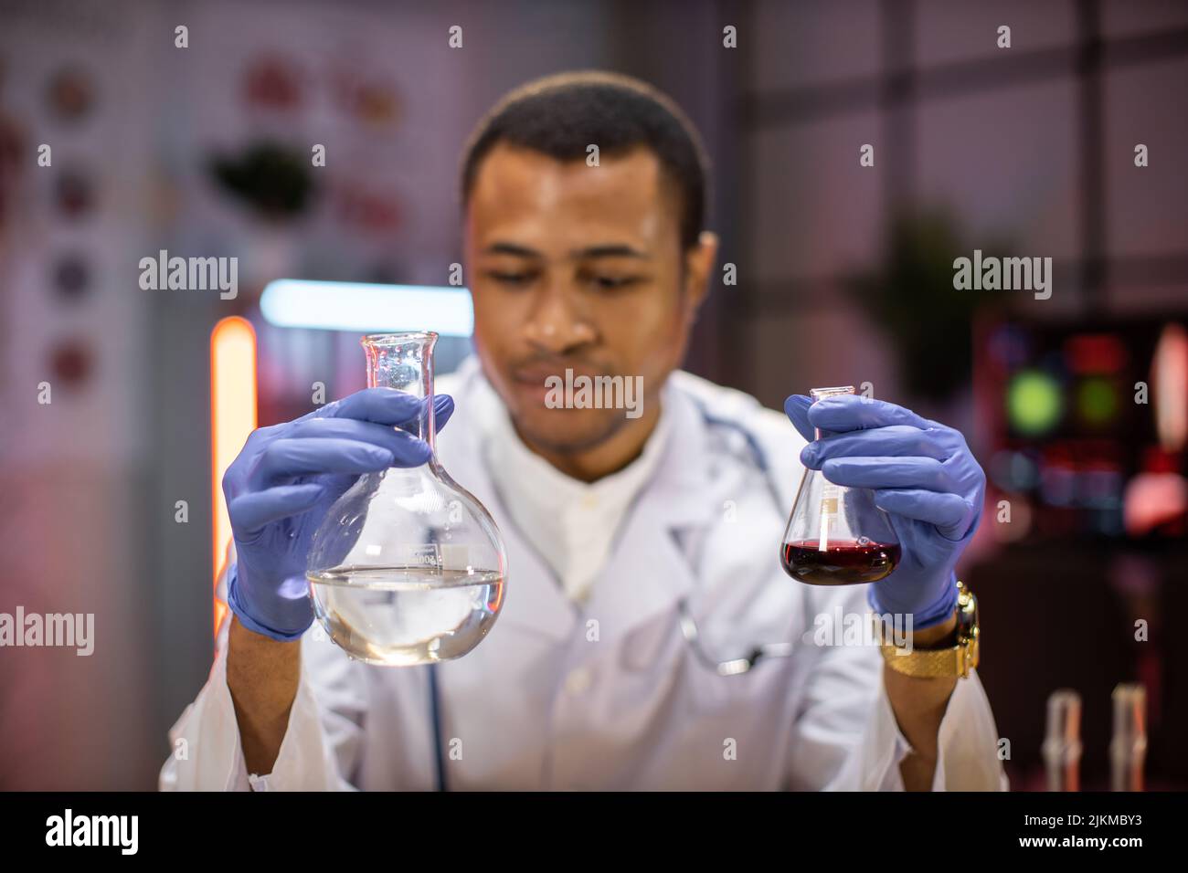 Male scientist working in modern lab. Doctor making microbiology ...
